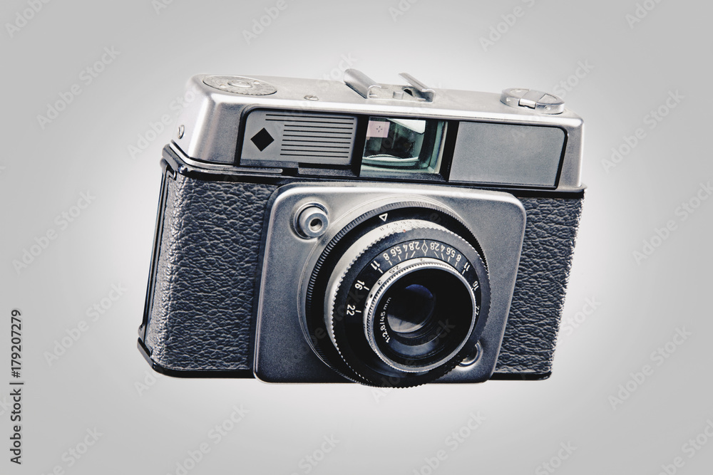 Floating camera on a grey background Stock Photo | Adobe Stock