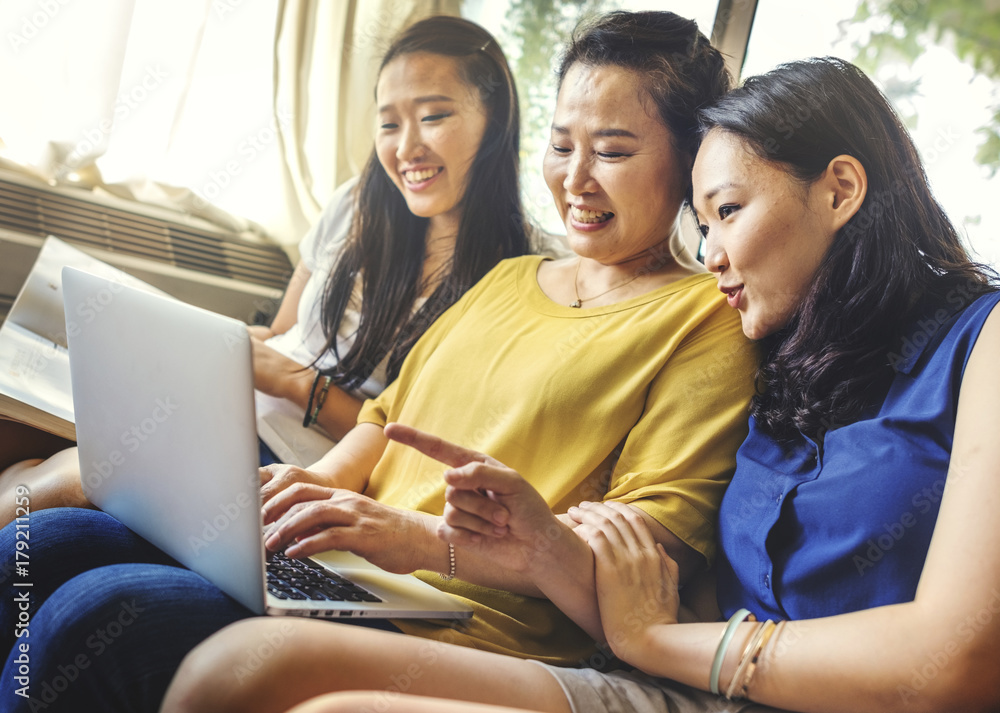Asian family is using computer laptop together Stock Photo | Adobe Stock