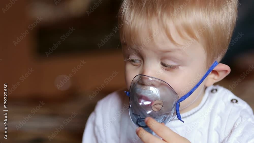 Nebulizer for inhalation, sick child breathes through nebulizer, baby ...
