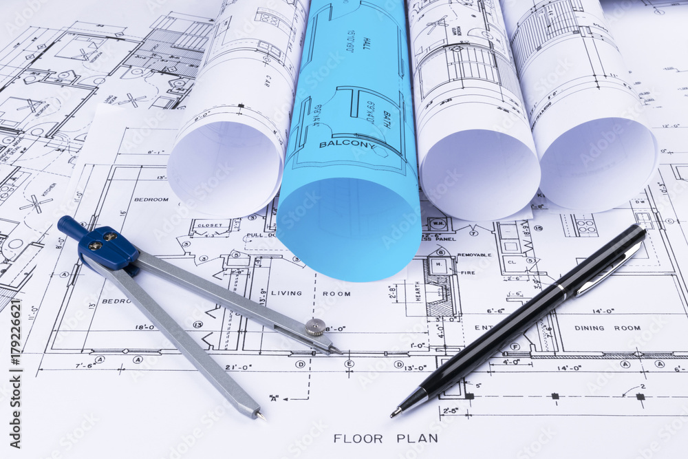Architectural blueprints and blueprint rolls and a drawing instruments ...