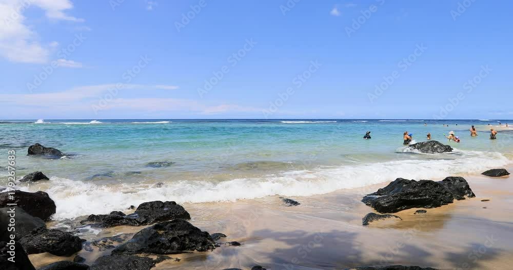 Family Kee Beach Haena State Park fun in sandy ocean surf. Garden Isle ...