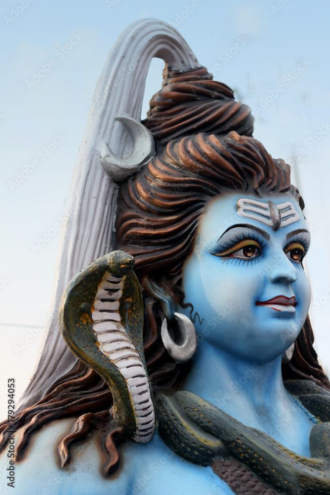 Statue of Hindu God Shiva with serpent around the neck and Ganga river ...