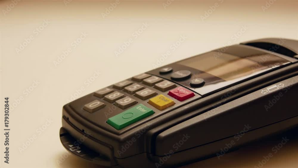 Paying with a tablet device wirelessly over credit card terminal. 4k ...