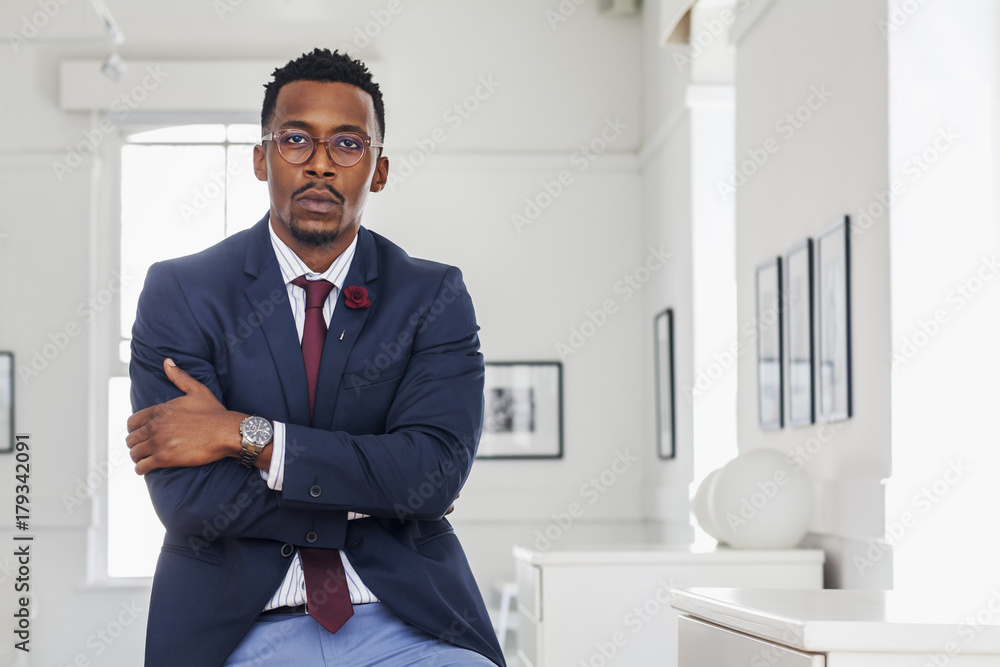Black man with arms crossed in gallery Stock Photo | Adobe Stock