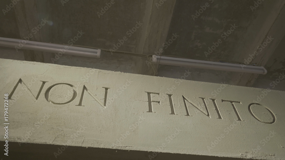 The inscription that means it is not the end on the grey wall. Isolated ...
