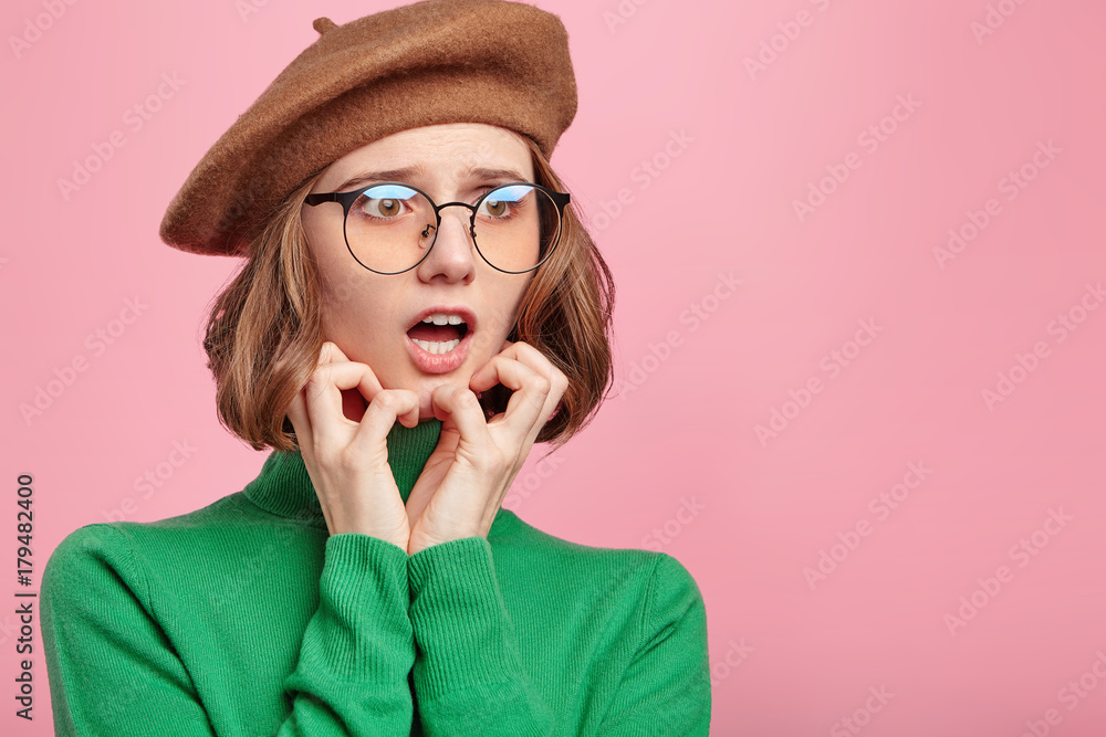 Nervous terrified beautiful young woman in old fashionable outfit ...