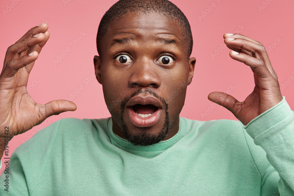 Omg, what I see. Terrified scared black man looks in terror with jaw ...