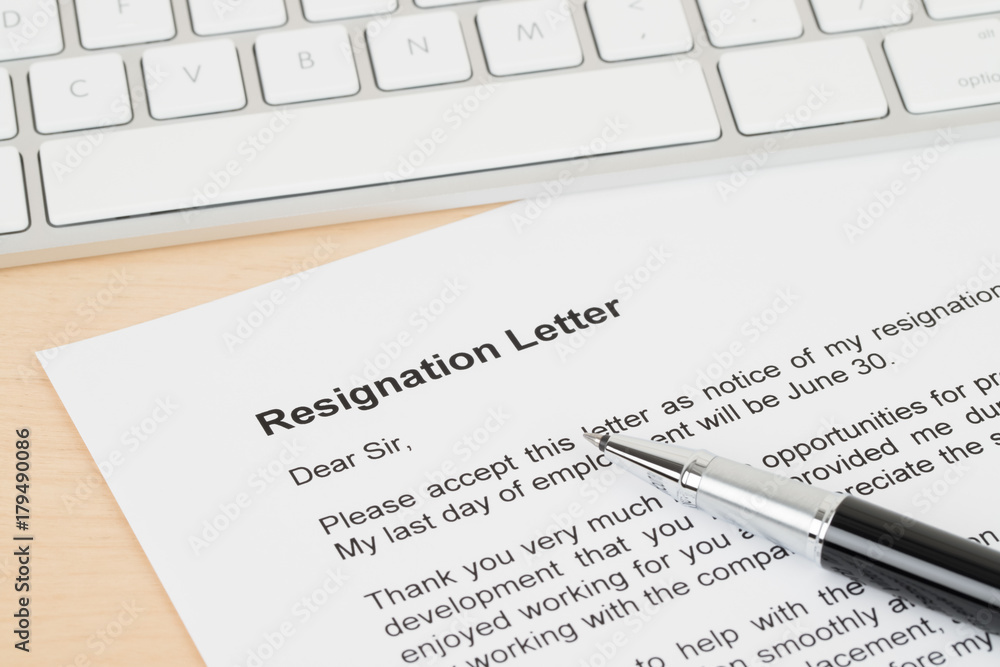 Resignation letter resign with pen and keyboard Stock Photo | Adobe Stock