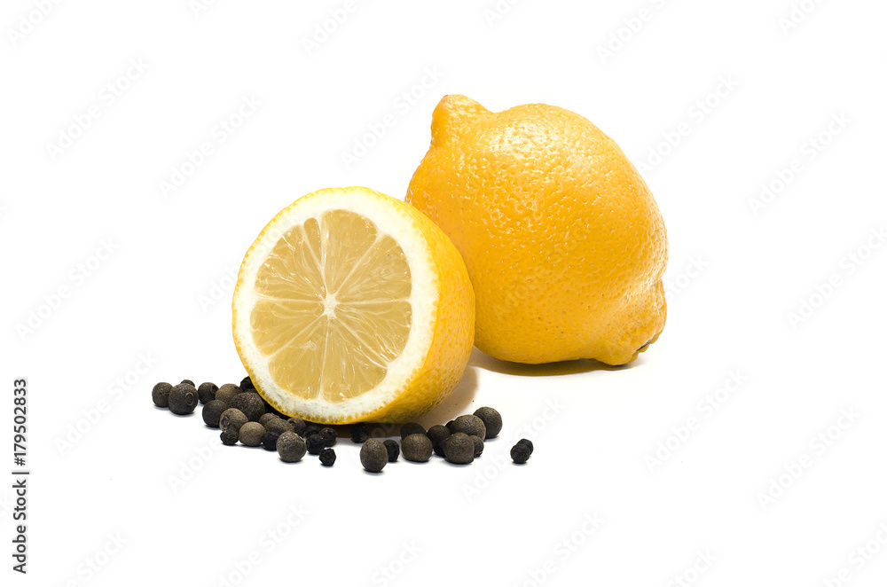 Lemon and black pepper. One whole lemon and its half and black pepper ...