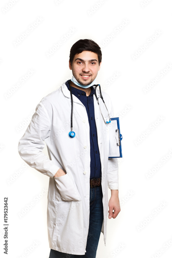 beautiful young doctor in a dressing gown with a stethoscope on a white ...