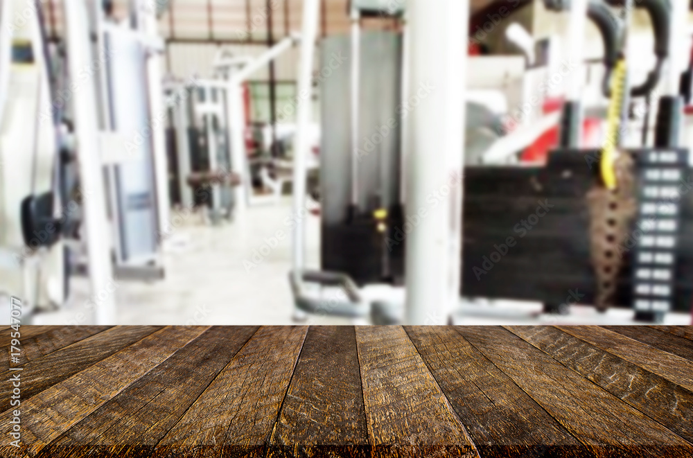 Wooden table on blurred background of fitness gym interior of modern ...