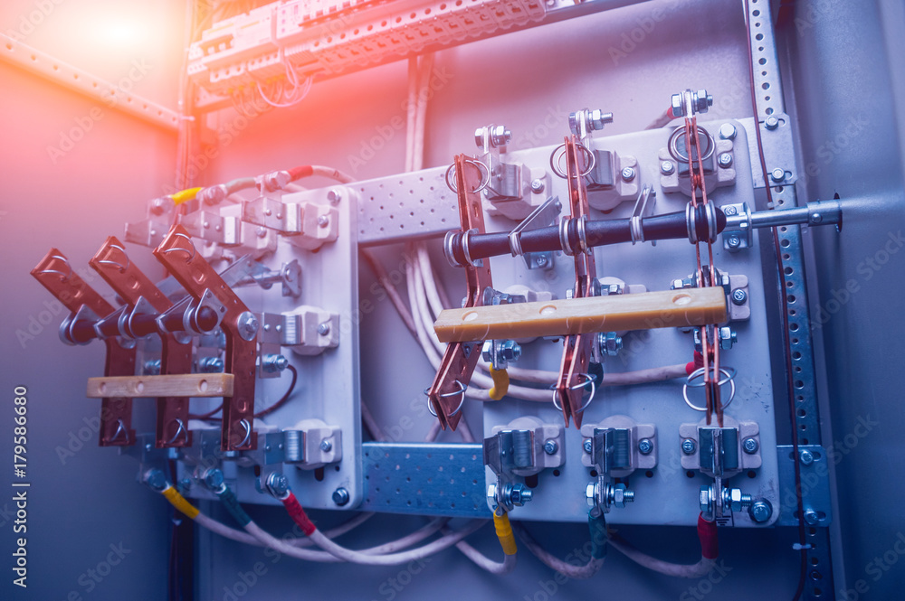 Wires and switches in electric box. Electrical panel with fuses and ...