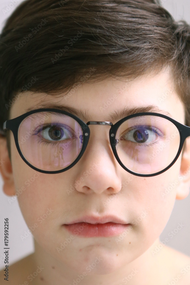 teenager kid boy in myopia correction glasses close up portrait Stock ...