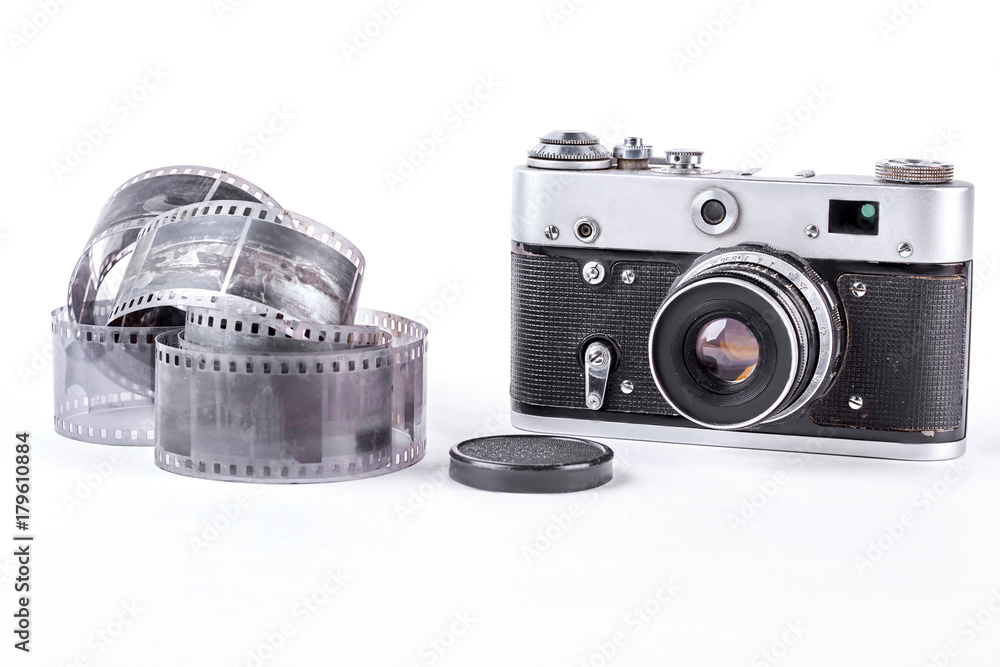 Old film tape and camera. Aged camera and film stripe isolated on white ...