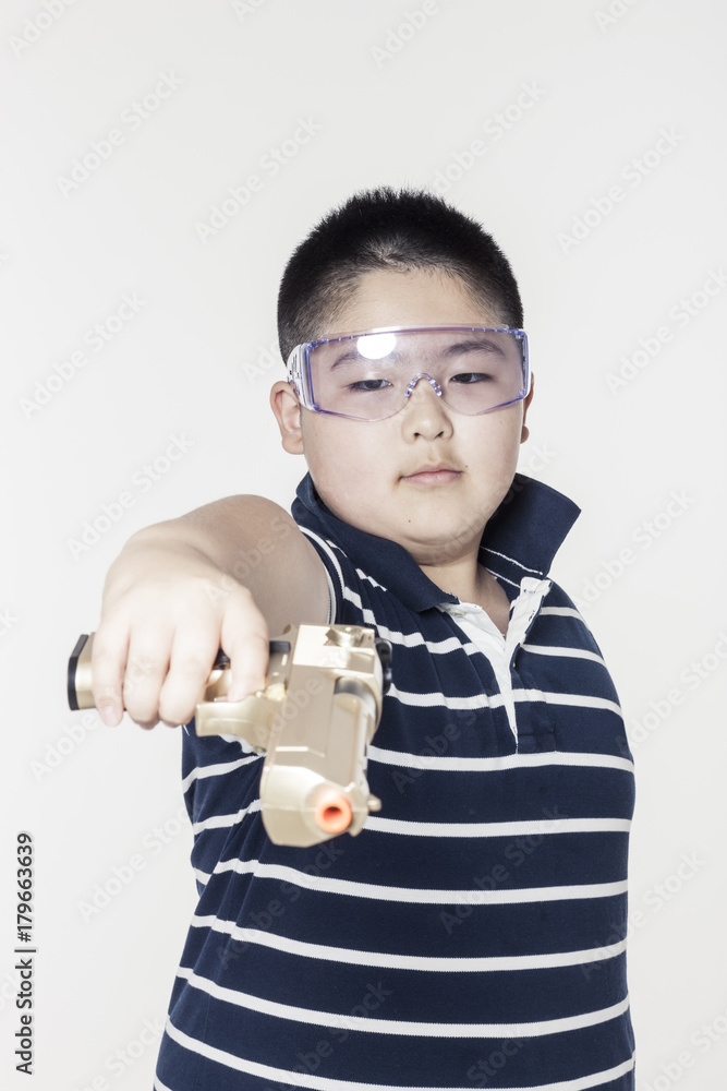 A fat boy hand hold a toy gun with glasses isolated white. Stock Photo ...