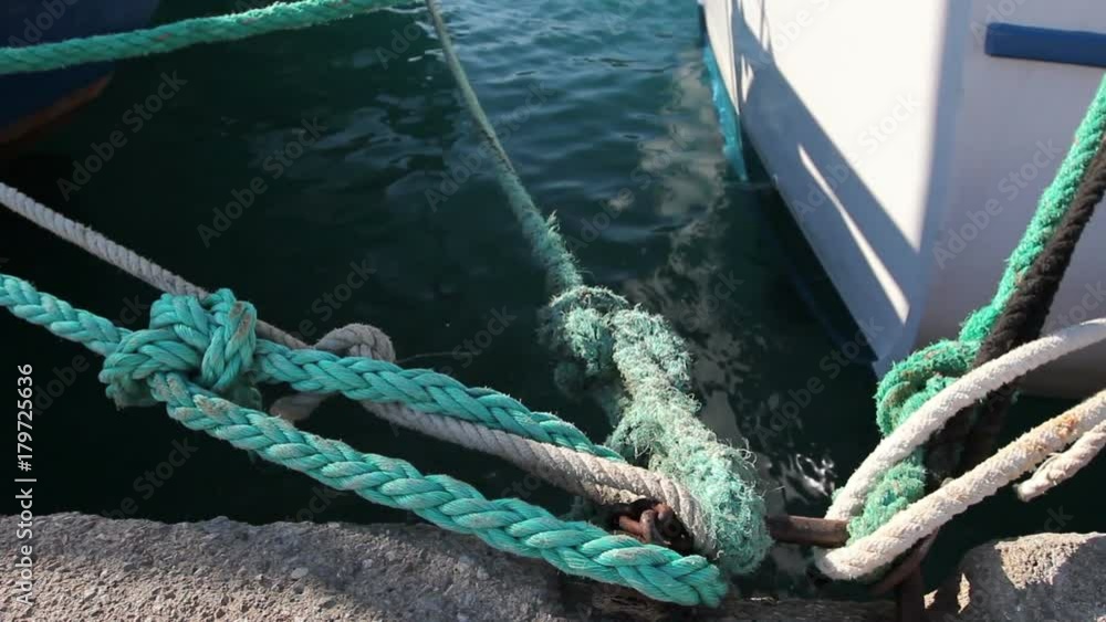 Place on the pier where ships are tied with ropes Place where fishing ...