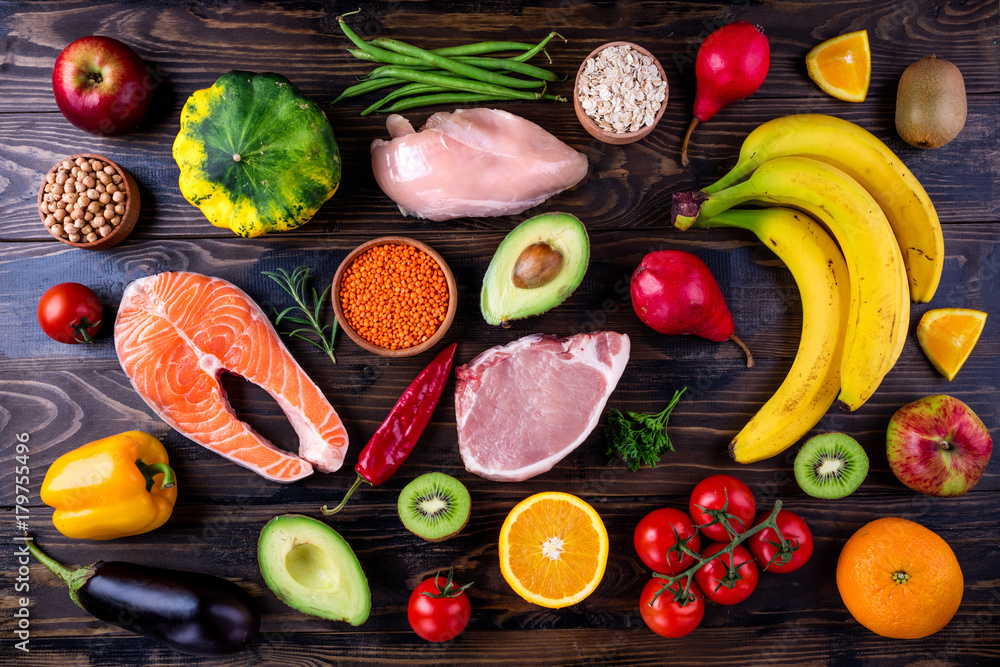 Healthy food background. Fish, meat, grains, vegetables, fruits on ...