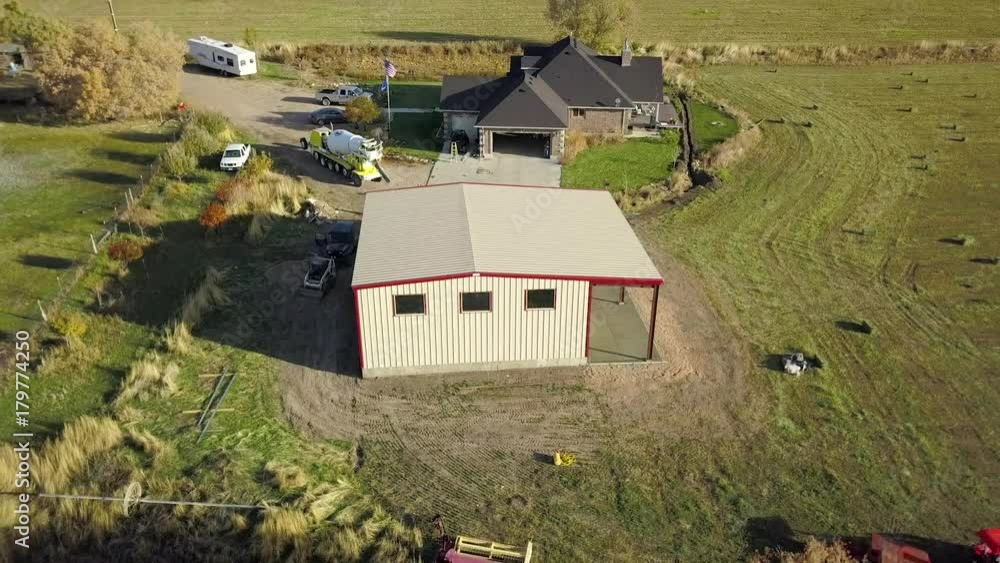 Aerial rural farm house work shed pull back. Construction of rural farm ...