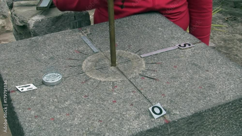 Equator line stone landmark with indicators of compass North South West ...