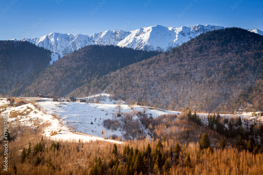 beautiful winter landscape in Romania with old, traditional houses ...
