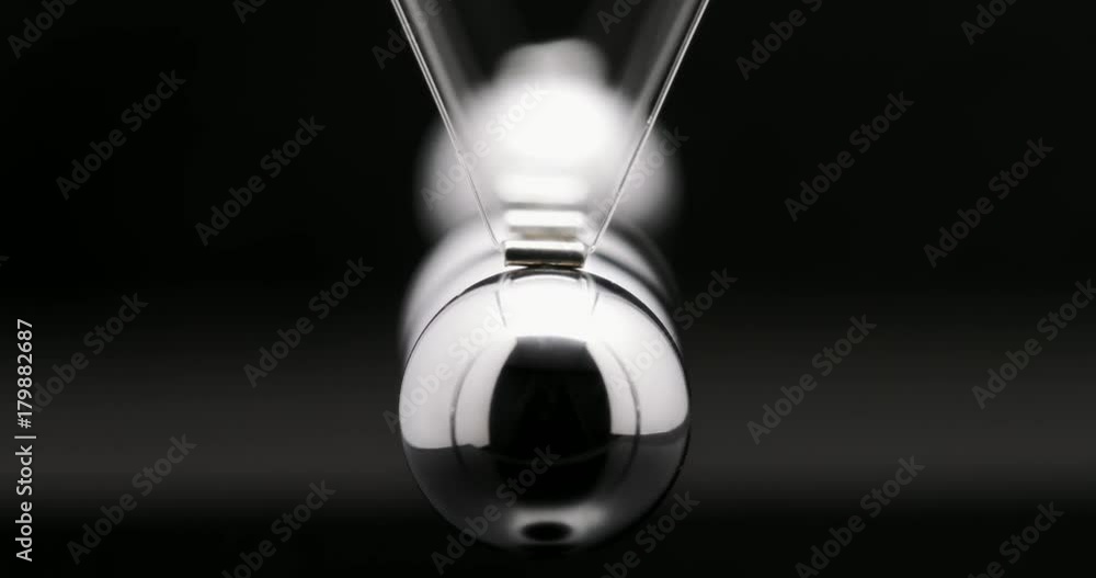 Executive Ball Clicker With Swinging Metal Spheres In Slow Motion Stock ...