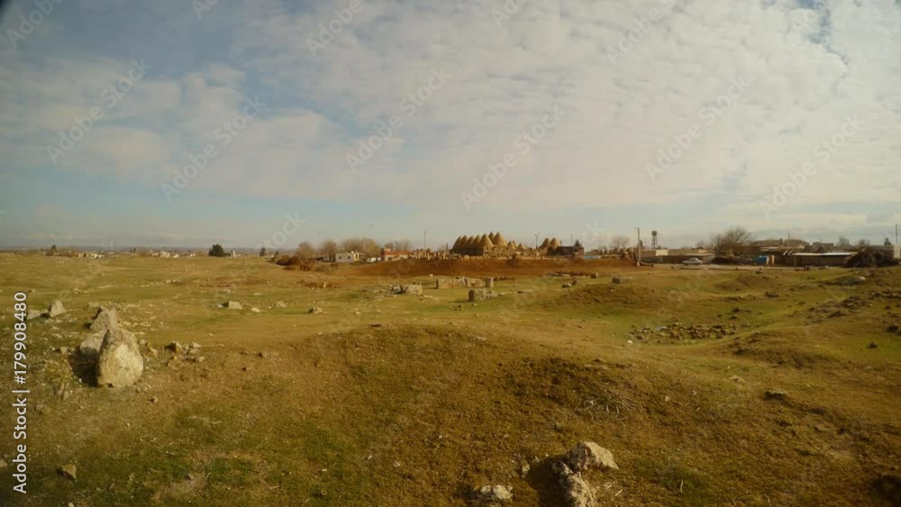 Middle East clay village in the distance, wasteland on the border of ...