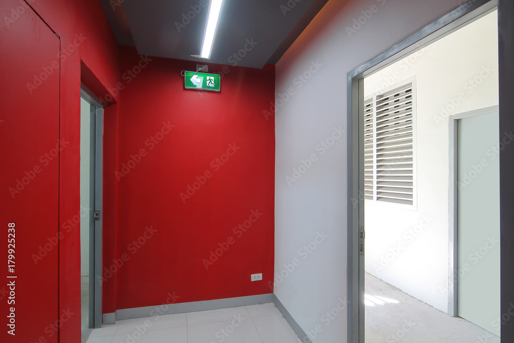 Emergency exit of the building with fire exit sign and fire escape ...