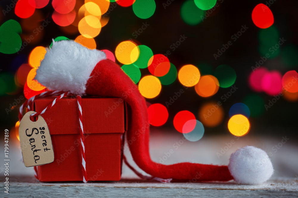 Christmas Present Or Box For Secret Santa With Santa Hat Greeting Card christmas-present-or-box-for-secret-santa-with-santa-hat-greeting-card