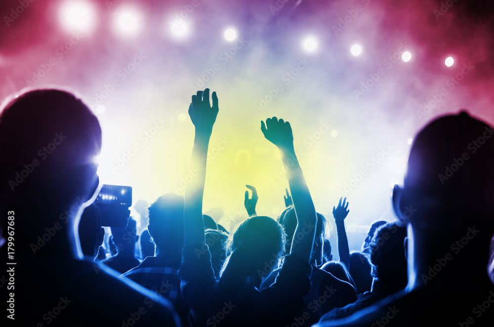 Concert Crowd. Silhouettes young people in front of bright stage lights ...