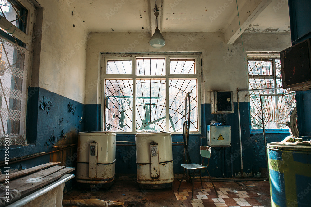 Creepy old laundry room in abandoned hospital Stock Photo | Adobe Stock