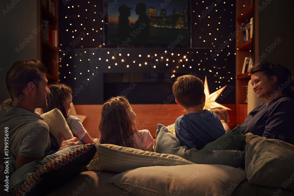 Family Enjoying Movie Night At Home Together Stock Photo | Adobe Stock