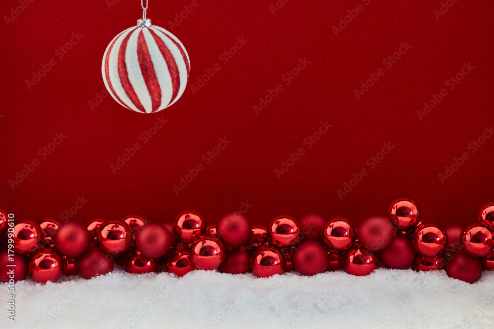 Christmas ball on red background Stock Photo | Adobe Stock