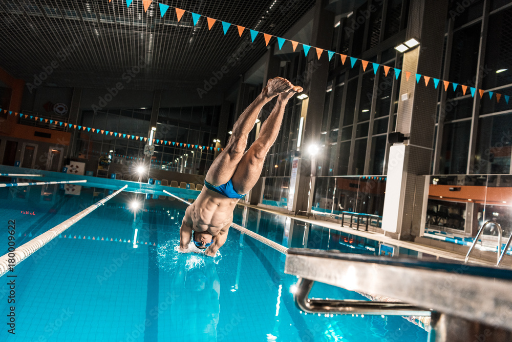 swimmer diving in swimming pool Stock Photo | Adobe Stock