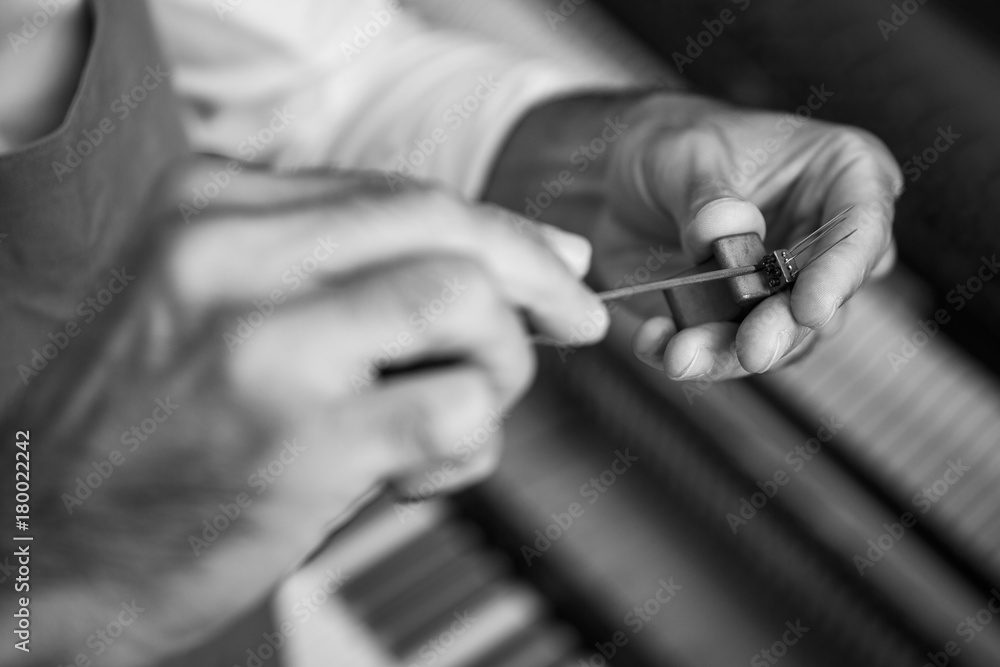 Technician tuning a upright piano using lever and tools Stock Photo ...