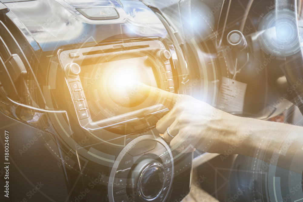 Transportation,technology and vehicle concept - man using car system ...