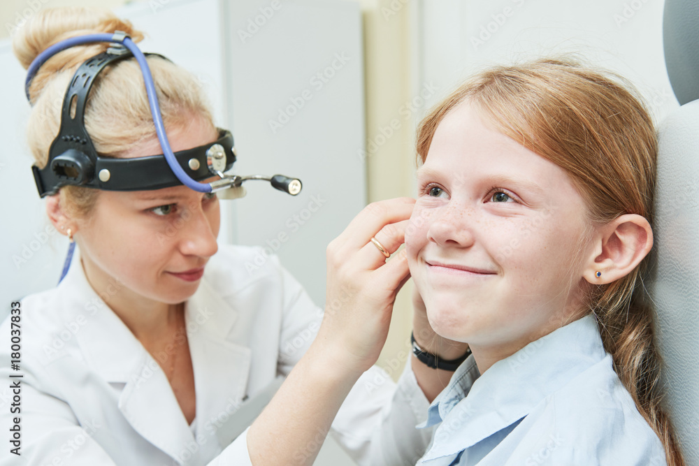 female doctor of ENT ear nose throat at work examining girl ear Photos ...