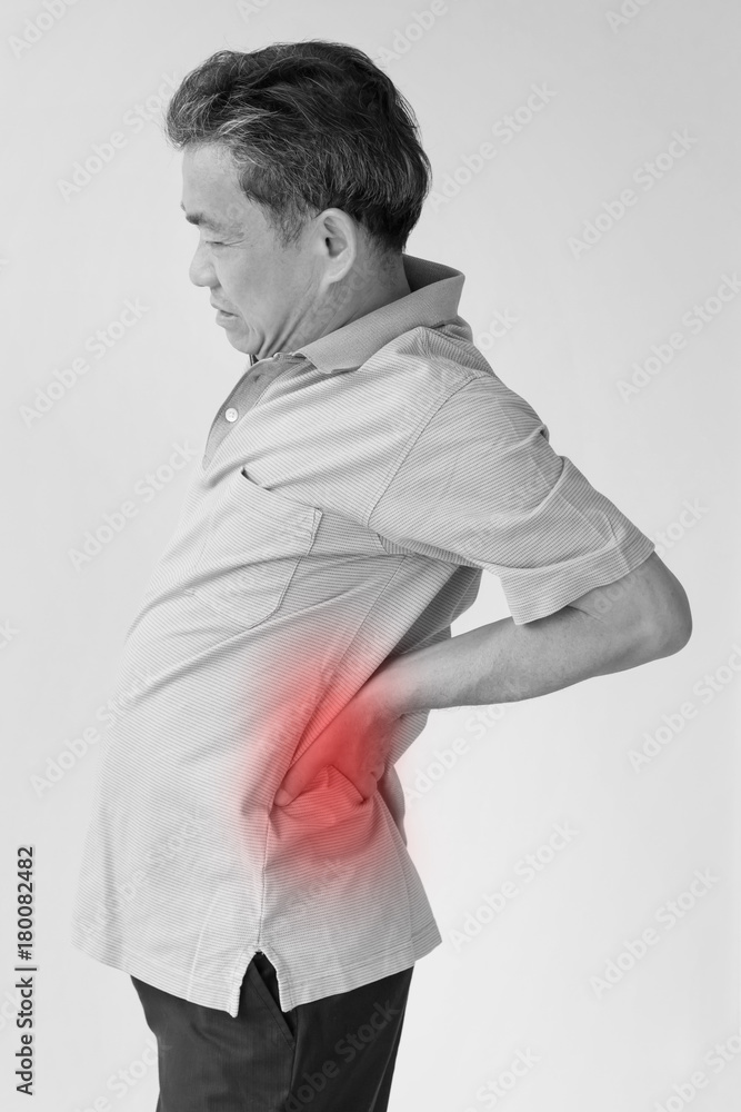 man suffering from back pain, hand holding back Stock Photo | Adobe Stock