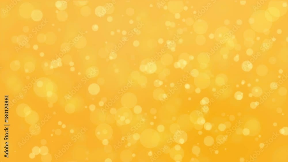 Beautiful glowing orange bokeh background with floating yellow light ...