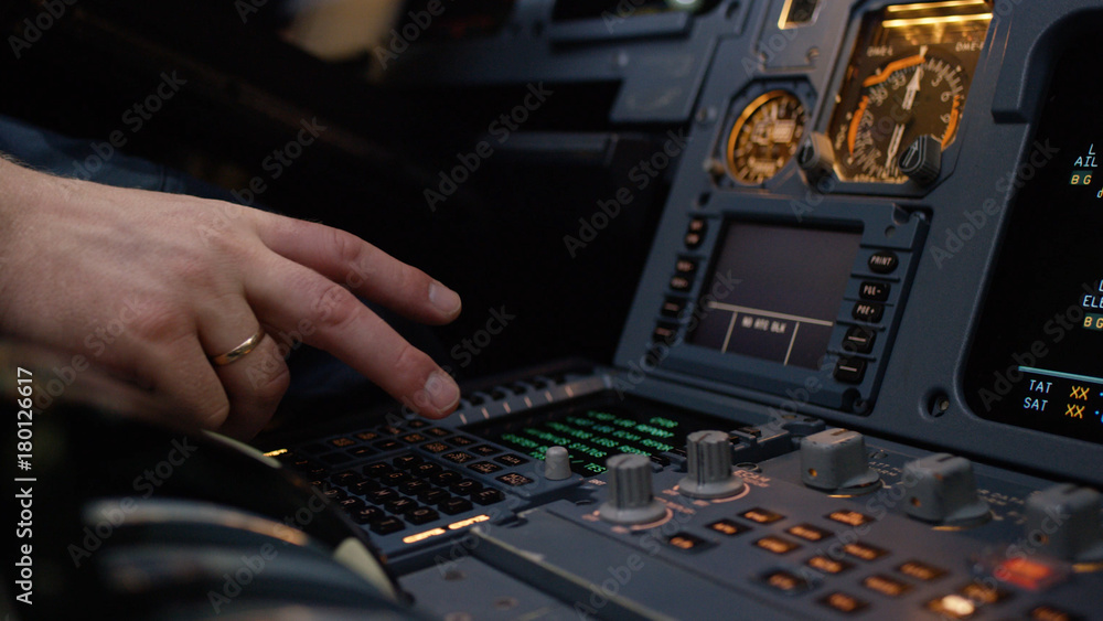Panel of switches on an aircraft flight deck. Autopilot control element ...
