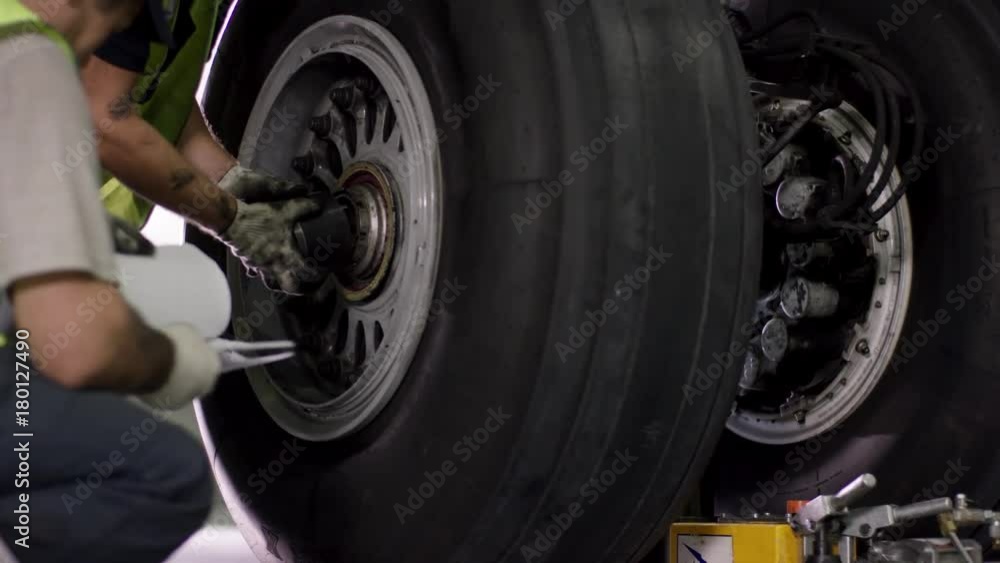 Aircraft brake repair. Close up of airplane wheel and shaft. Huge ...