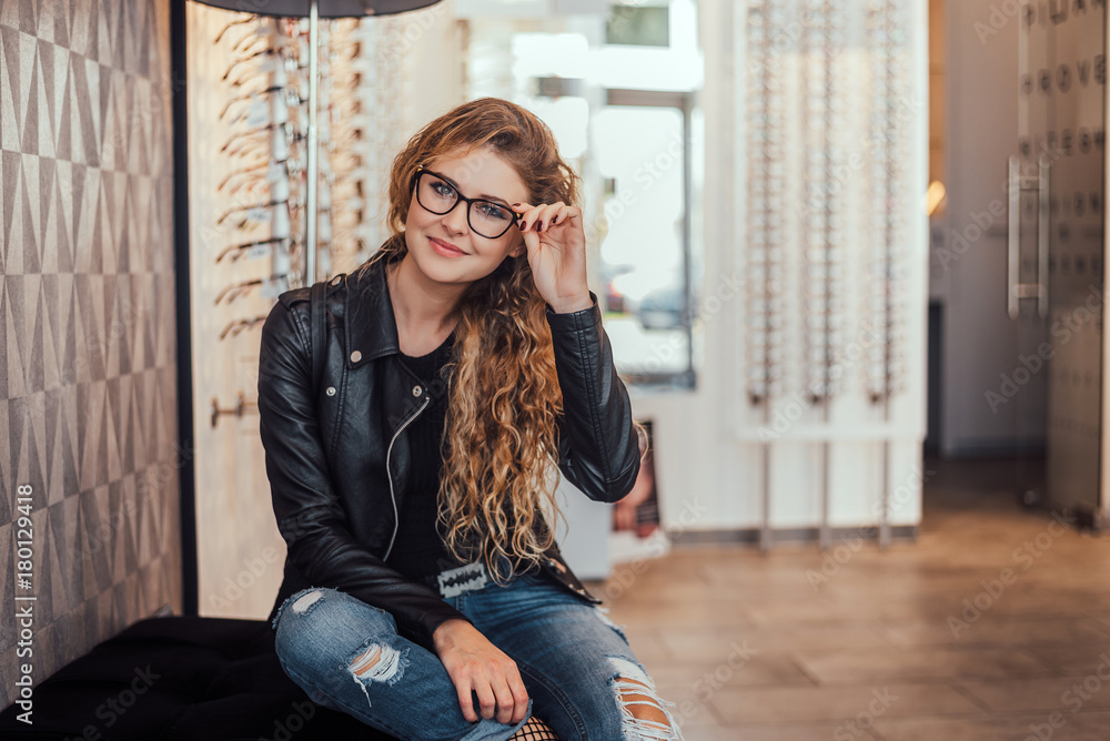 Beautiful woman with new glasses in optical store. Stock Photo | Adobe ...