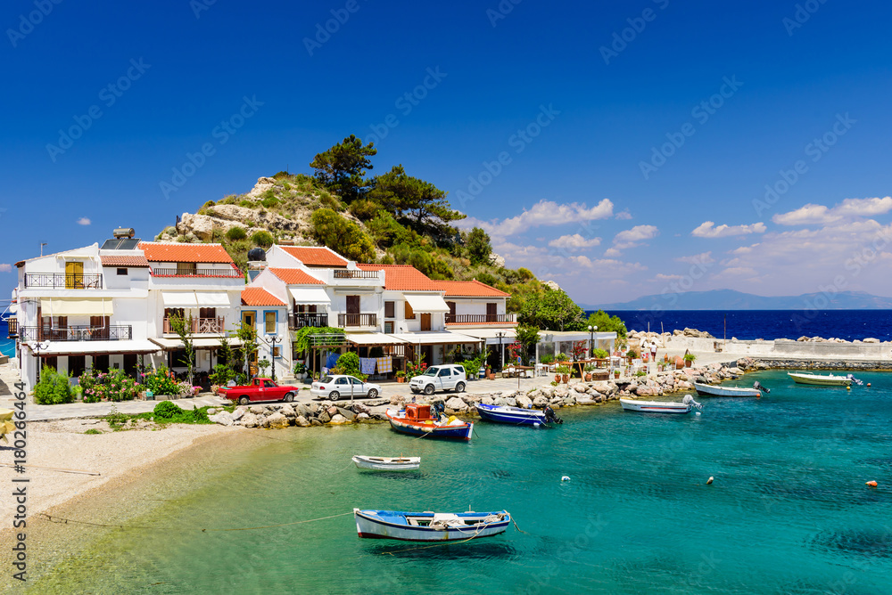 The picturesque village of Kokkari with traditional houses and fishing ...