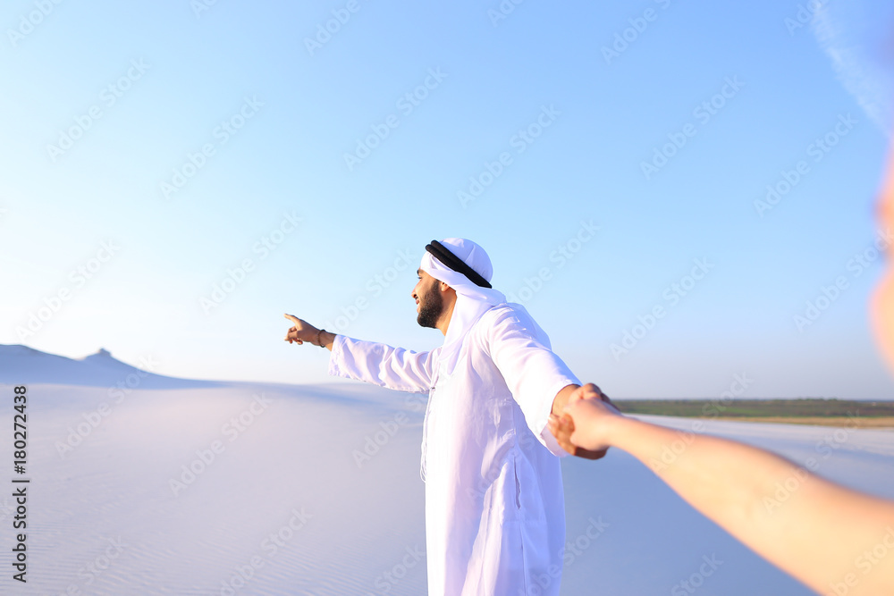 Portrait of beautiful Emirate male tourist guide, who holds woma Stock ...