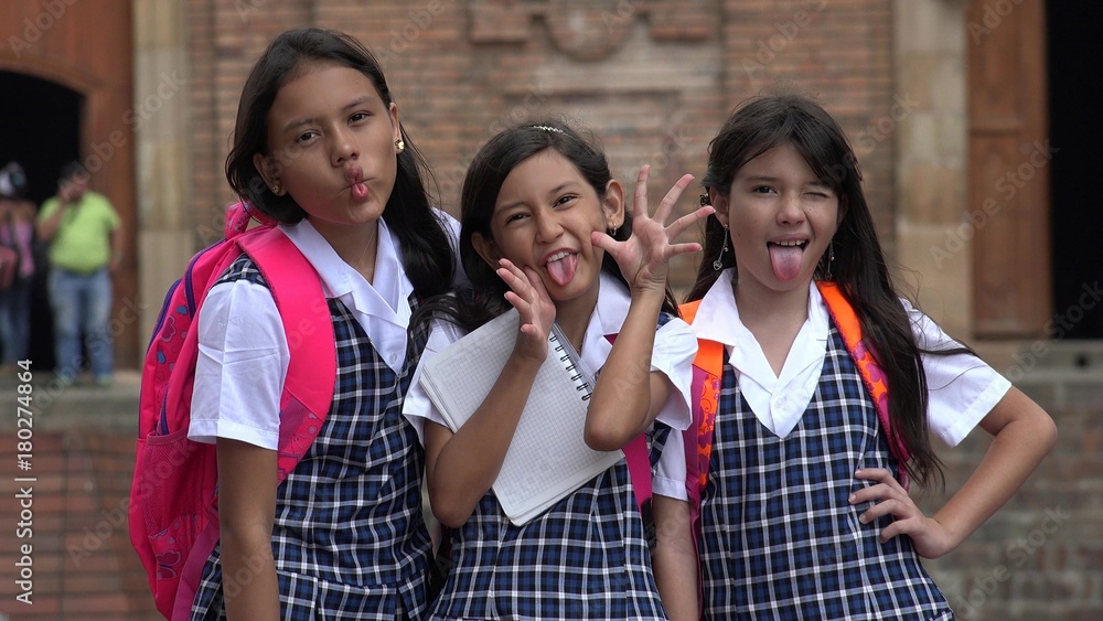 Silly Hispanic Female Students Wearing School Uniforms Stock Photo ...
