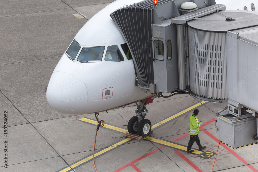 airplane at an airport gate Stock Photo | Adobe Stock