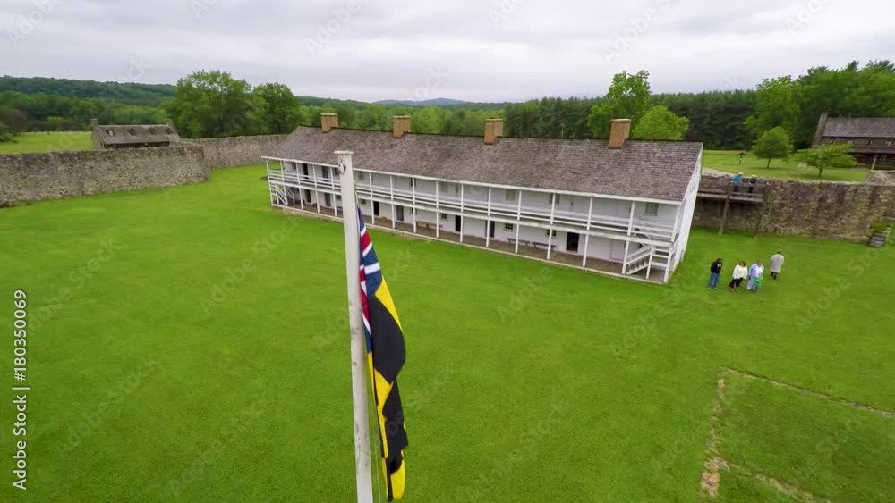 Aerial of the Calvert Arms/King’s Colors flag waving in the breeze with ...