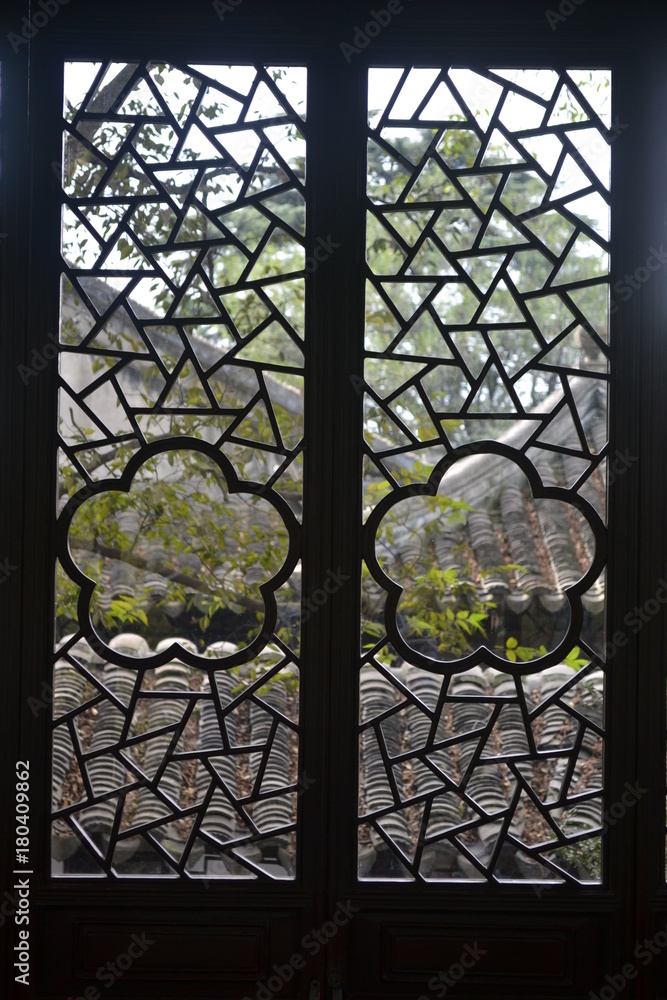 Elegant traditional window frame inside a old mansion in Zhou Zhuang ...