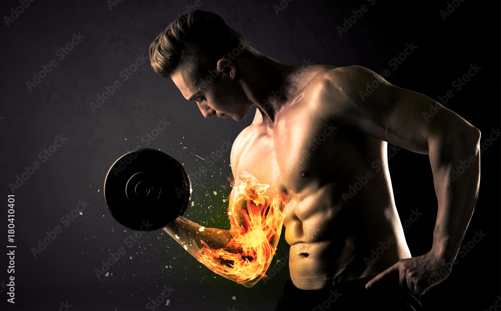Bodybuilder athlete lifting weight with fire explode arm concept Stock ...