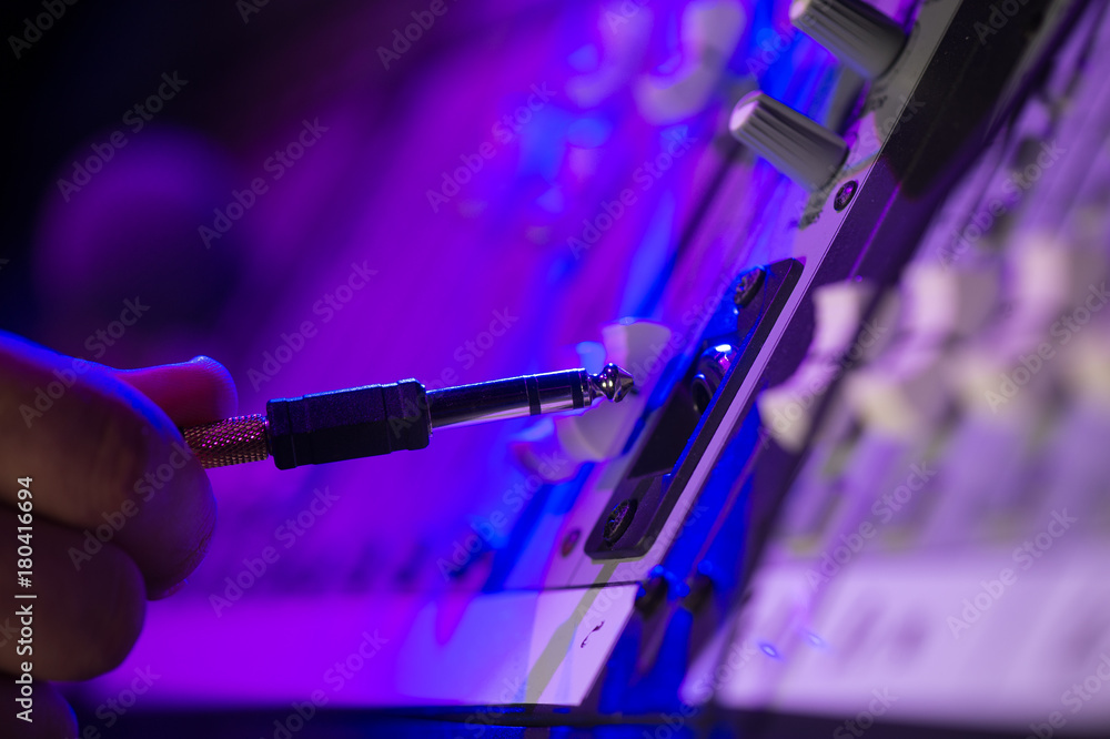 Audio jack Dj mixer dj mix music on the console the dj s hand Stock ...