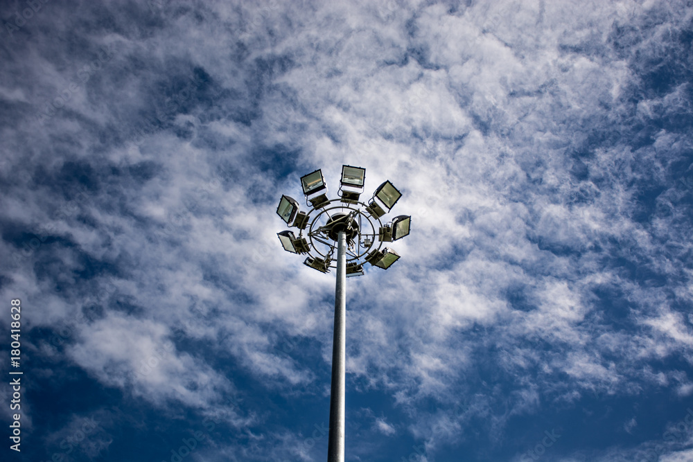 Spot-light tower with dramatic sky background, Spot-light tower with ...
